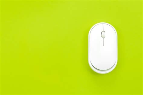 Computer Mouse On A Green Background Isolated Flat Lay Free Photo