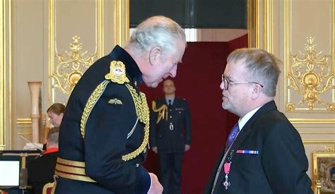 Receiving The Mbe From King Charles At Windsor Castle
