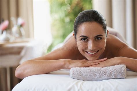 You Should Get A Massage Portrait Of An Attractive Woman Resting On A Massage Table Stock
