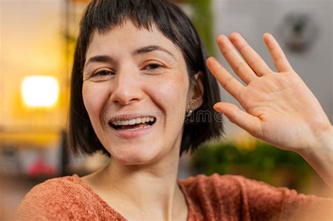 Pov Of Young Woman Making Online Video Call Talking Waving Hand Hello Looking At Camera Blowing