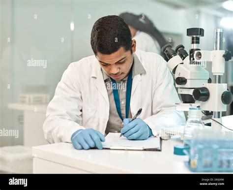 Noting Down Some Important Details From His Investigation A Young