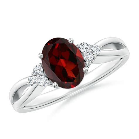Solitaire Oval Garnet Split Shank Ring With Trio Diamonds