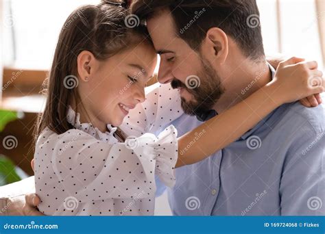 Happy Dad And Small Daughter Embrace Having Close Moment Together Stock