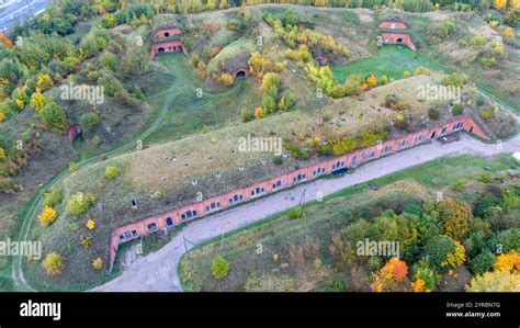 Aerial View Of An Old Fort Covered With Grass And Surrounded By Autumn