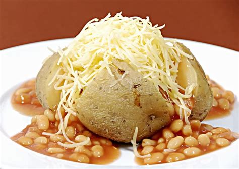 Delicious Jacket Potato With Cheese And Baked Beans