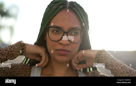 One Young Black Latina Young Woman Playing Box Braided Hairstyle