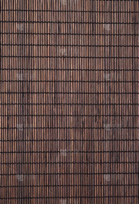 一个深褐色的竹席的特写