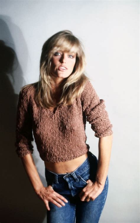 Farrah Fawcett Wearing A Brown Sweater And Blue Jeans 1970s Photo