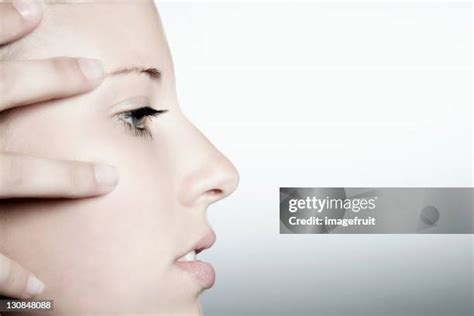 Side View Womans Face With Hand On Cheek Photos And Premium High Res