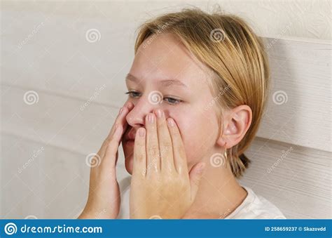 A Teenage Girl Massages Her Face With Her Hands With Cream Stock Image