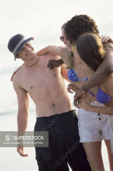 Two Teenage Couples Standing Together Superstock