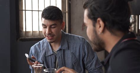 A Man Showing His Smartphone To Another Man Free Stock Video Footage