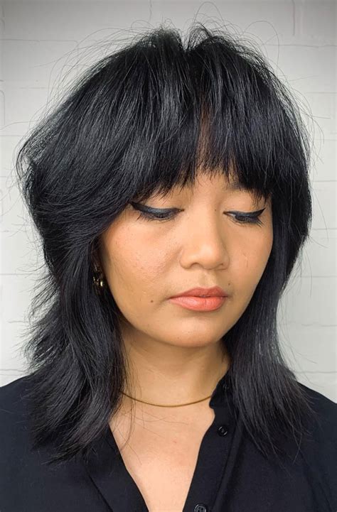 Edgy Shoulder Length Shag Haircut With Full Fringe For Thick Hair
