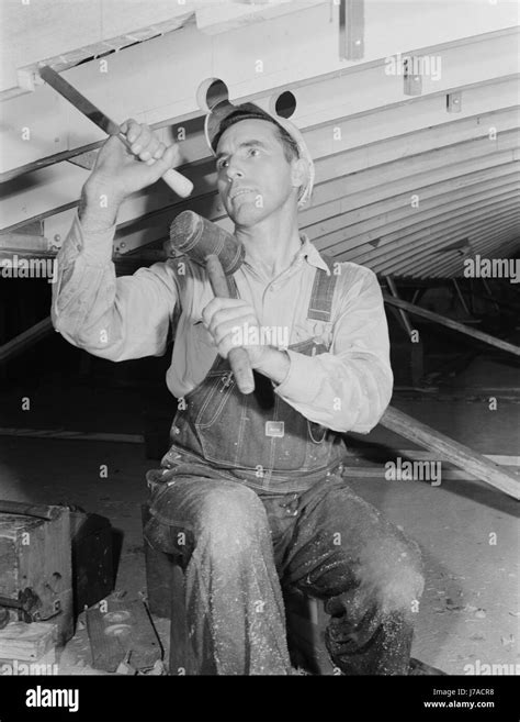 Man Working With A Chisel On A Beam Of A Motor Torpedo Boat For The