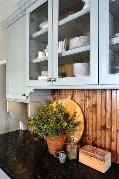 How To Style The Glass Cabinet Doors In Your Kitchen — Designed