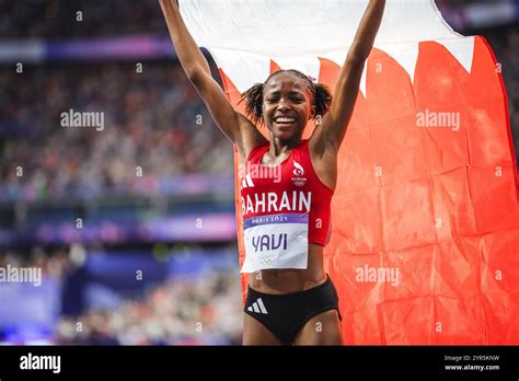 Winfred Yavi Celebrating Her Medal With Her Countrys Flag At The Paris