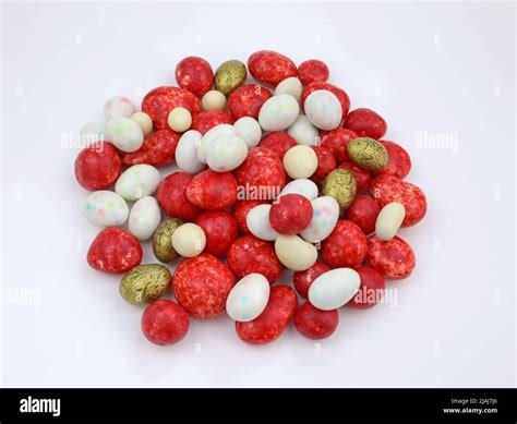 Colored Dragees On A White Background Candies Round In Red Glaze Close