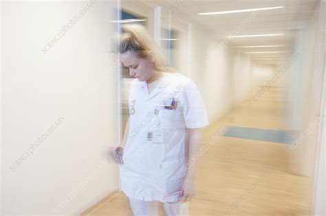 Nurse Checking Pager Stock Image C0490861 Science Photo Library