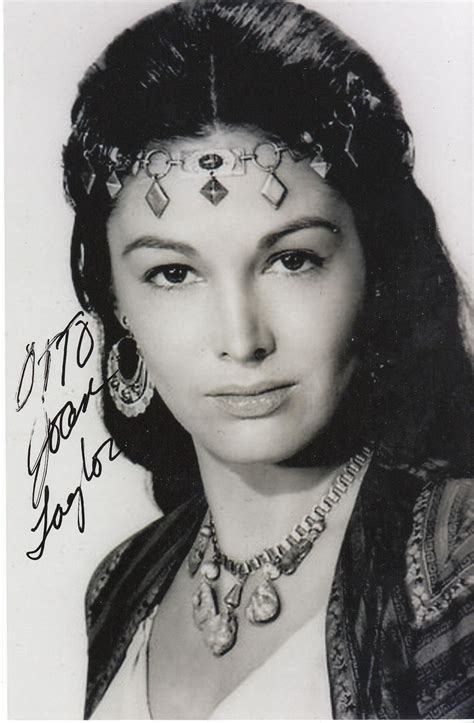 An Old Photo Of A Woman Wearing Jewelry