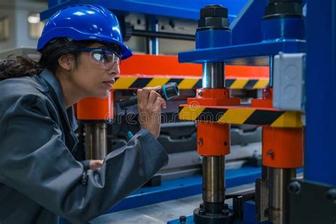 Female Engineering Technology Professional Holding A Flashlight