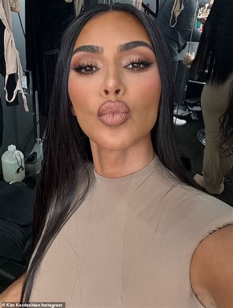 Kim Kardashian Sticks Out Tongue And Pulls Famous Mega Pout As She