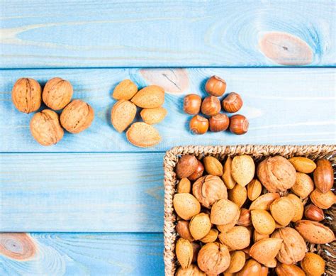 Different Types Of Nuts In A Shell On A Wooden Background Stock Image Image Of Background