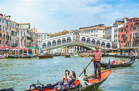 Traditional Gondola Ride On The Grand Canal Near Rialto Bridge Ponte