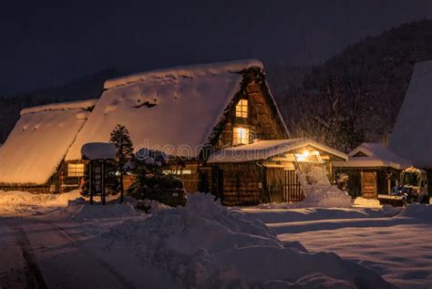 Snow Falls On Traditional Japanese Gassho Zukuri House At Night Stock Image Image Of Night