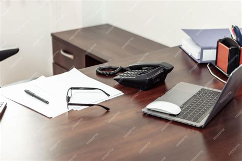Premium Photo Workspaces Of Office Worker Desk With Laptop Phone And