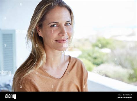 Portrait Smiling Blonde Woman On Patio Stock Photo Alamy