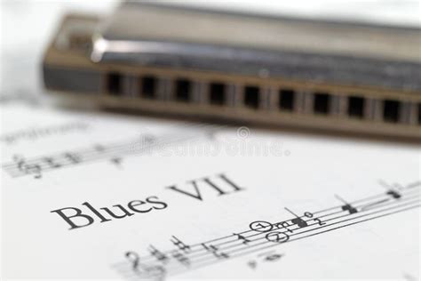 Harmonica And Music Notes In A Close Up Stock Image Image Of Blues