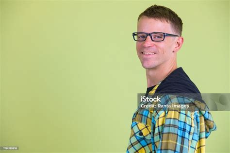 Closeup Profile View Of Happy Nerd Man With Eyeglasses Smiling And
