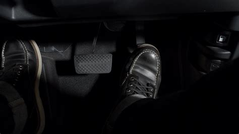 Accelerate And Brake Foot Pressing Foot Pedal Of A Car To Drive Ahead