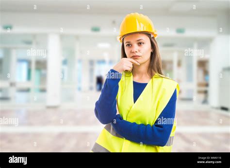 Young Attractive Female Engineer Thinking As Pensive Meditating For