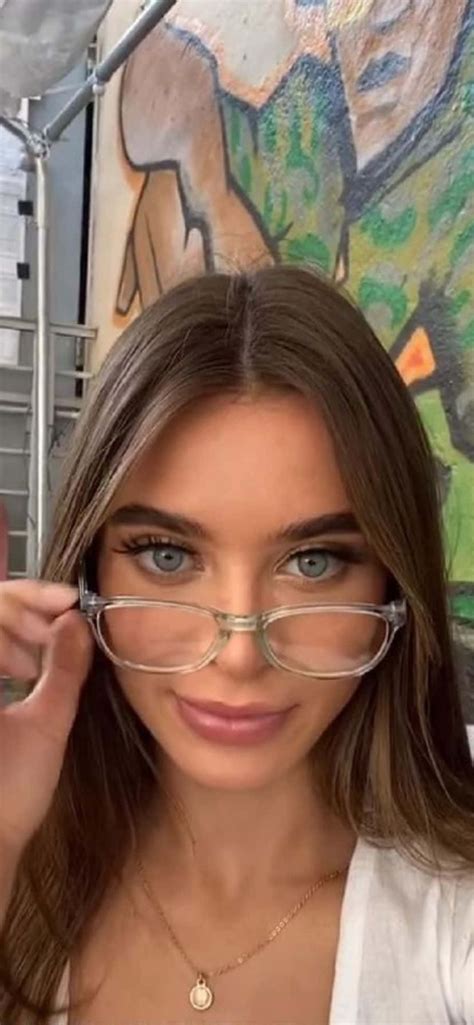 Download Womanwith Glassesand Painting Background Wallpaper