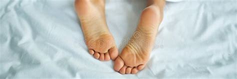 Banner Girland X27 S Feet Covered With White Bed Sheet Sleeping In A