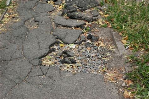 Broken Asphalt Road In The Green Grass Stock Image Image Of