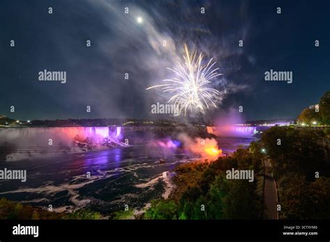 A Spectacular Night View Of Niagara Falls Featuring Both The Canadian