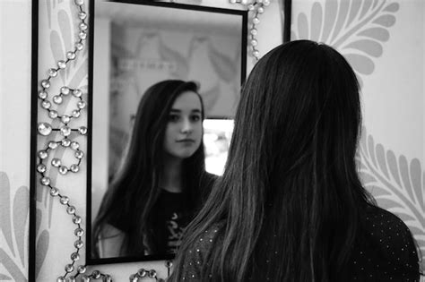 Premium Photo Rear View Of Woman With Reflection On Mirror At Home