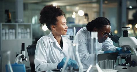 Women Microscope And Scientist Team Research In Lab For Experiment