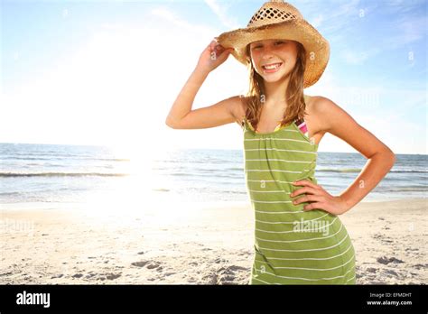 Happy Teenage Girl At The Summer Beach Shoot Against The Sun Stock