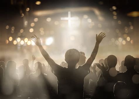 Christians Raising Their Hands In Praise And Worship At A Night Music