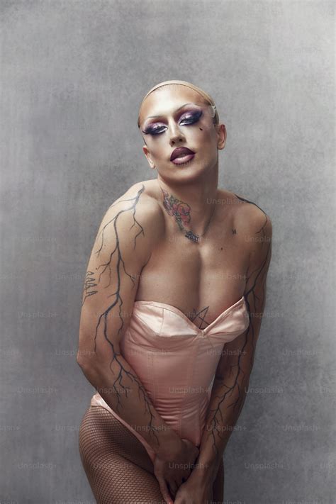 A Woman With Tattoos On Her Body Posing For A Picture Photo Art Image