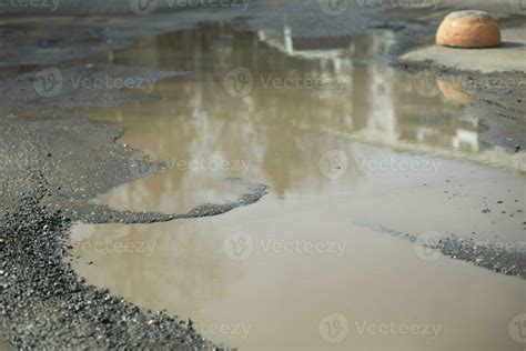 Big Puddle In Road Puddle And Mud Water In Spring 26682806 Stock