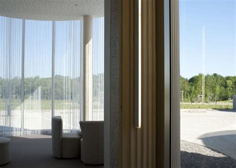 Plan 01s Crematorium Is Covered In Ribbed Concrete And Glass