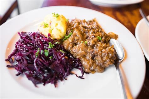 Premium Photo Beef Stew With Red Cabbage And Mashed Potatoes