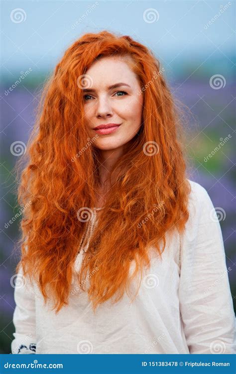 Summer Portrait Of A Beautiful Girl With Long Curly Red Hair Stock