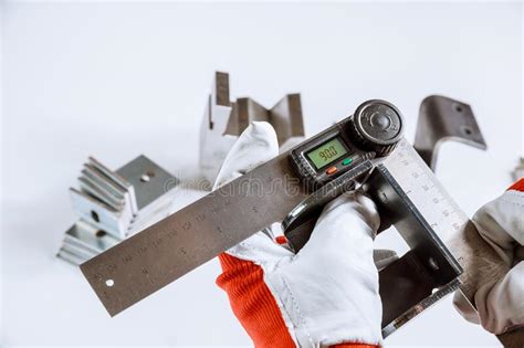 Accurate Measurement Of Metal Parts On A White Background With A Accurate Measurement Of Metal Parts On A White Background With A