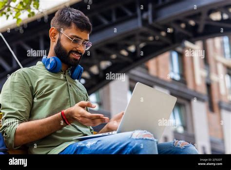 Portrait Indian Student Programmer Using Laptop Computer In Park Stock
