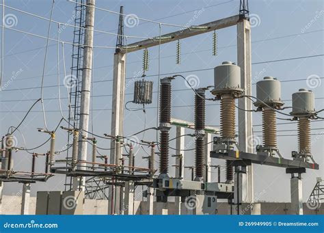 Part Of High Voltage Substation On Blue Sky Background With Switches
